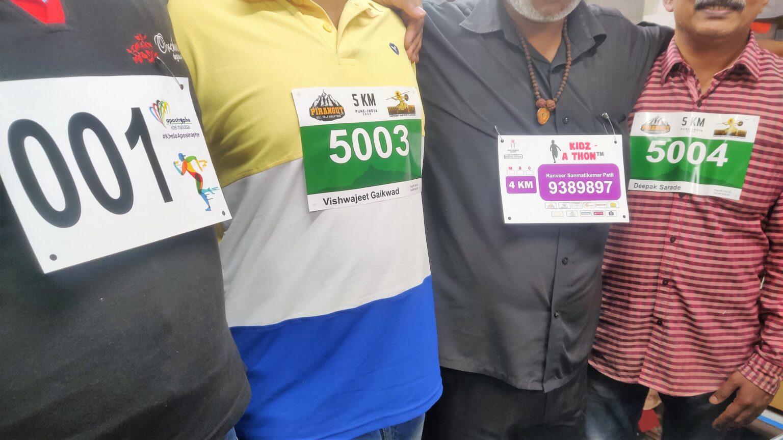 Marathon bibs with numbers, sponsors’ logos, & runner data